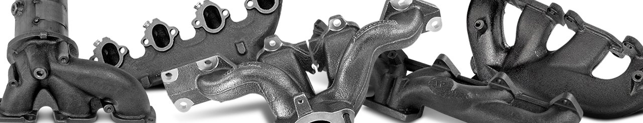 Why Do Some Replacement Exhaust Manifolds Come With Catalytic Converters?