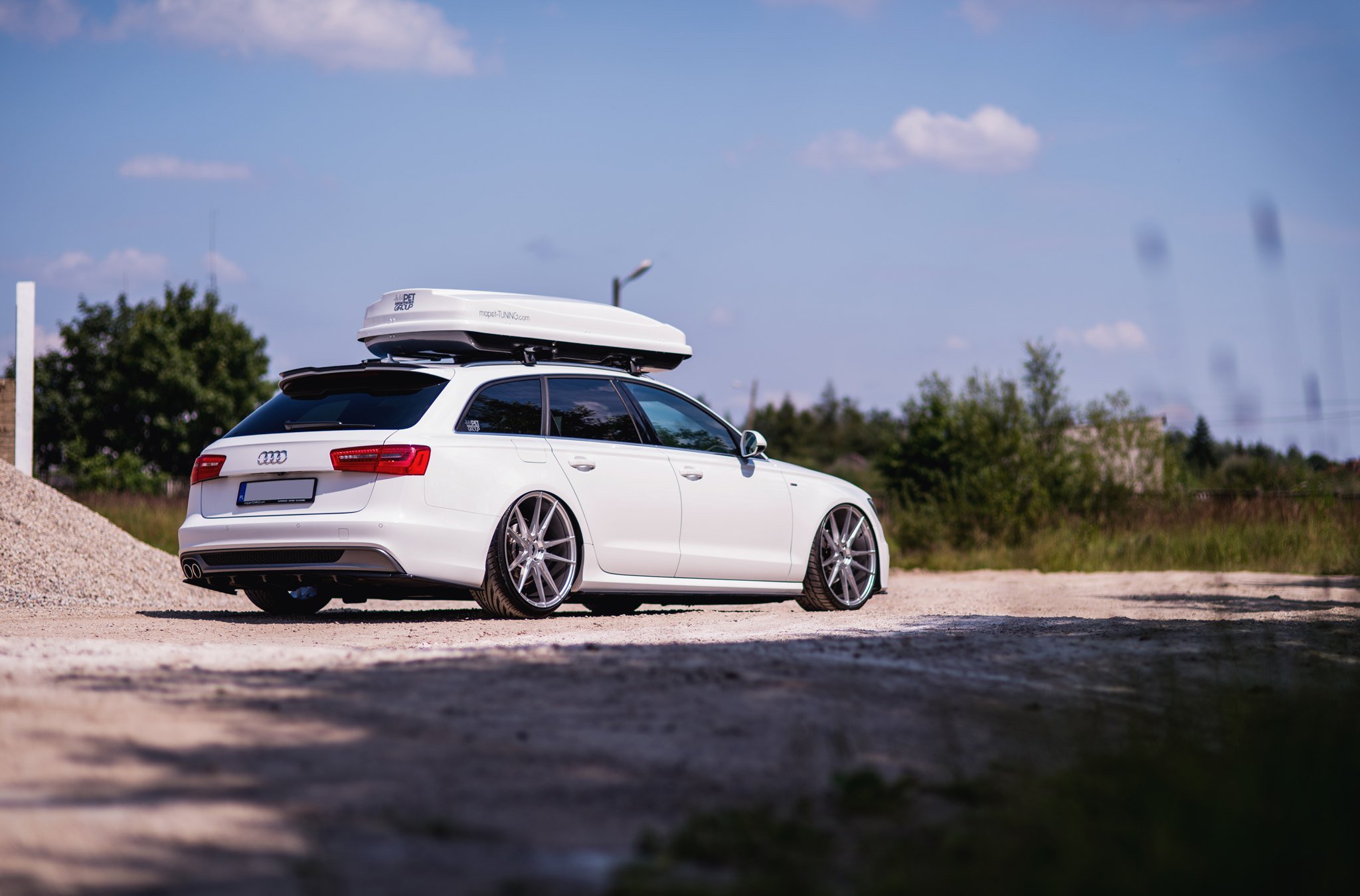 White Audi A6 Outfitted with Custom Roof Rack and Other Add-ons | CARiD ...