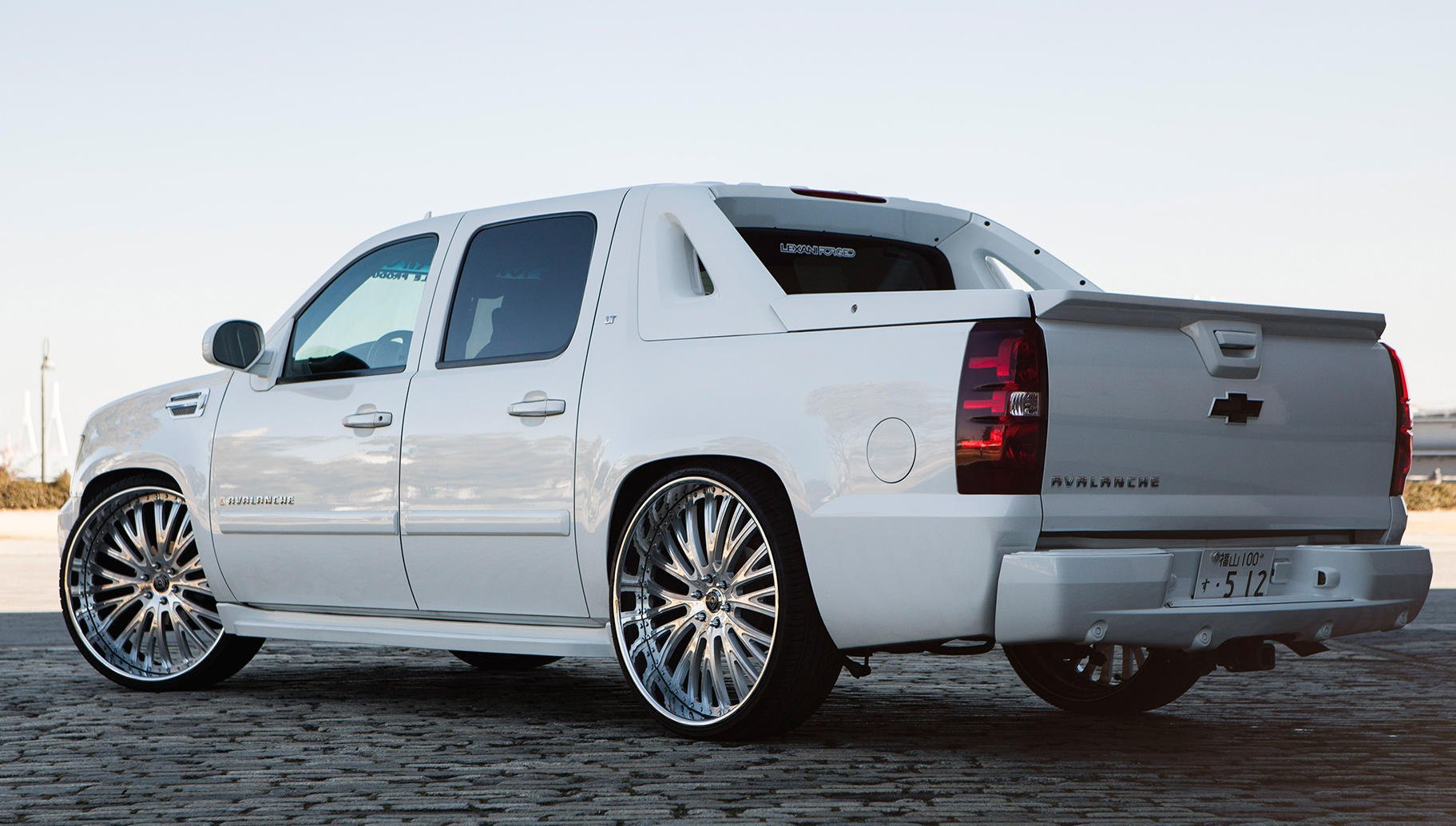 Snow White Chevy Avalanche on Lexani Chrome Wheels | CARiD.com Gallery