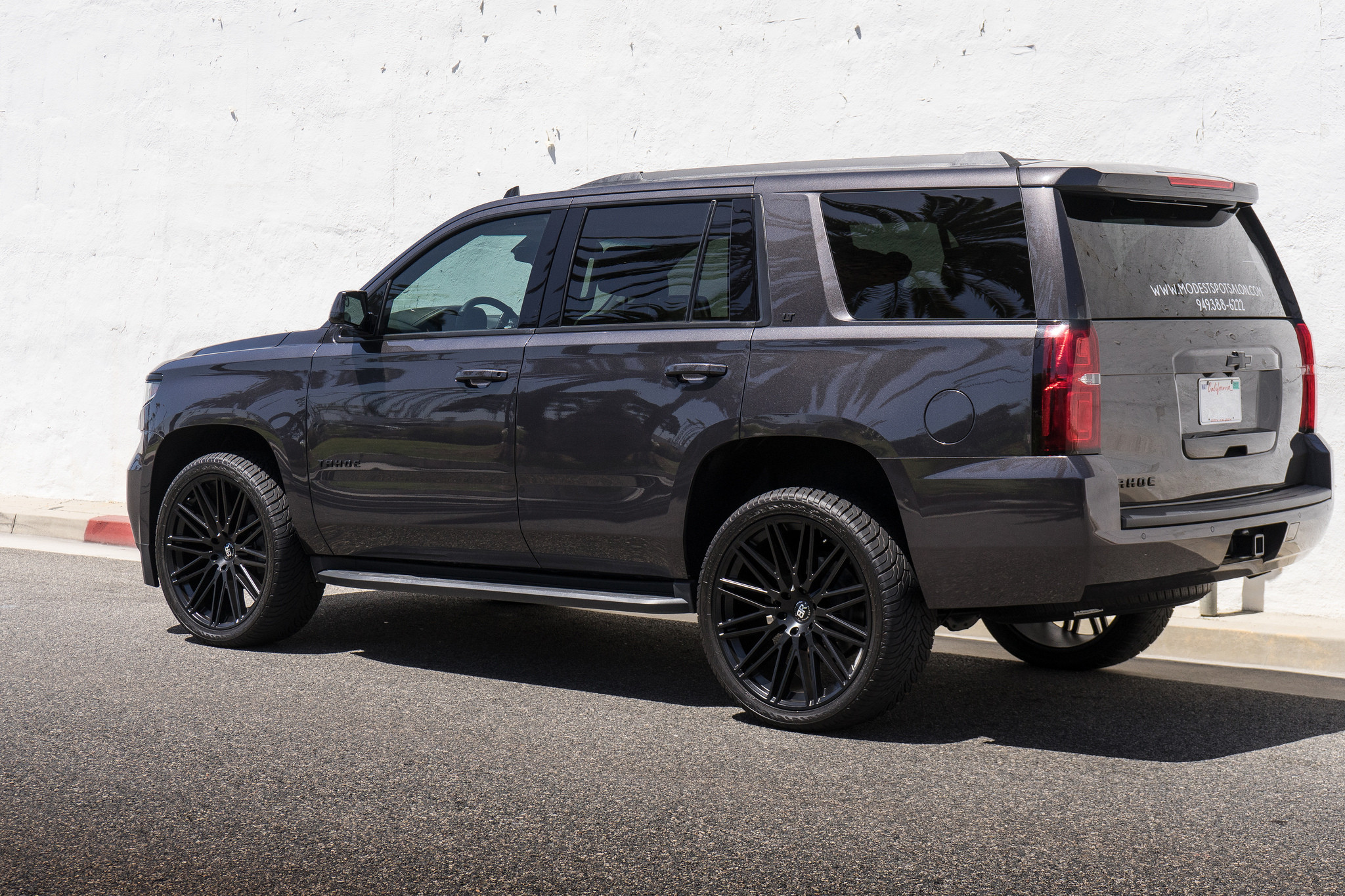 Black on Black Chevy Tahoe with Custom Projector Headlights | CARiD.com ...