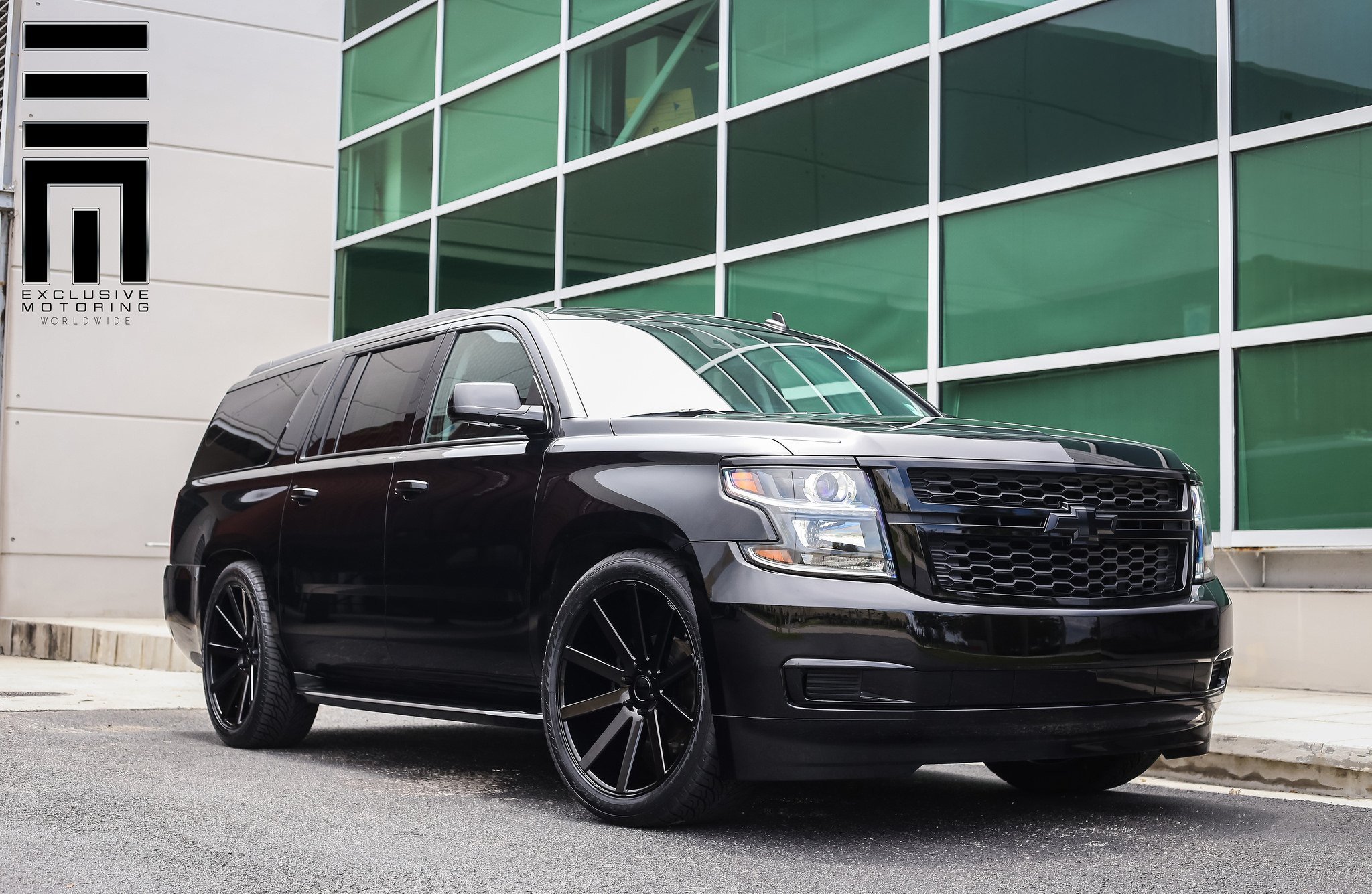 All Black Chevy Suburban on Custom Wheels by Exclusive Motoring | CARiD ...