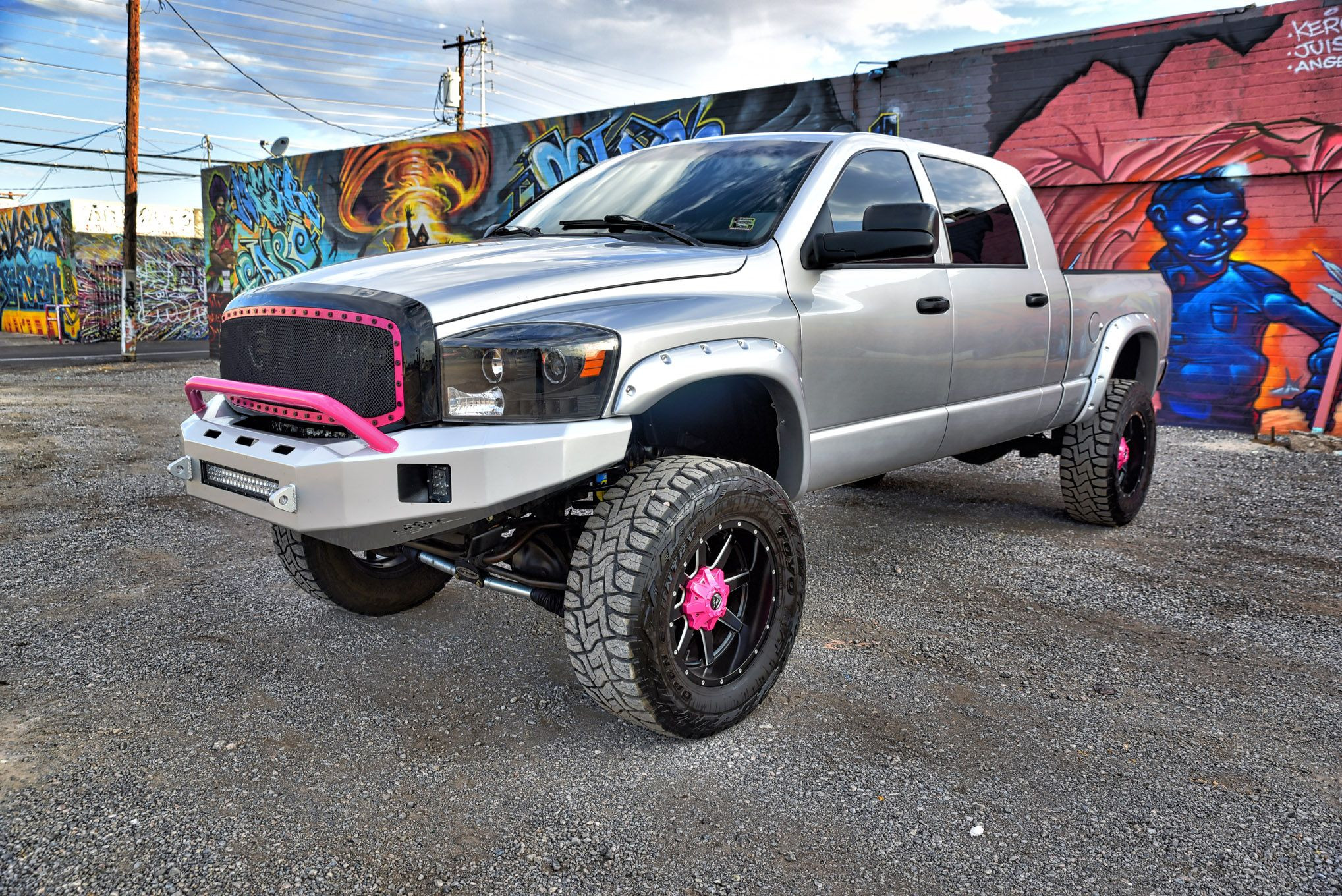 Stylish Lifted Gray Dodge Ram Featuring Pink Accents | CARiD.com Gallery