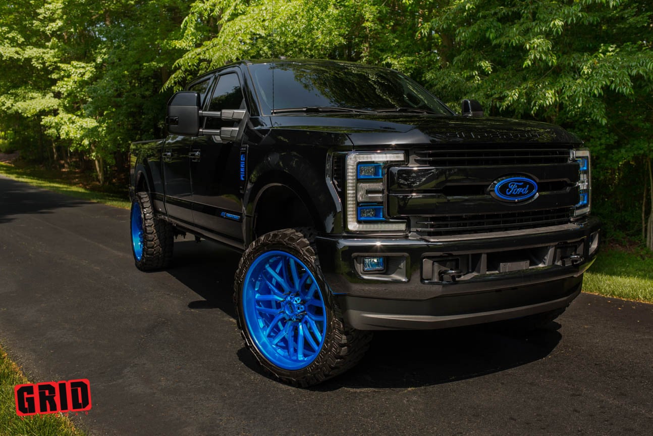 Blue Wheels and Contrasting Accents Make Black F-250 Stand Out | CARiD ...