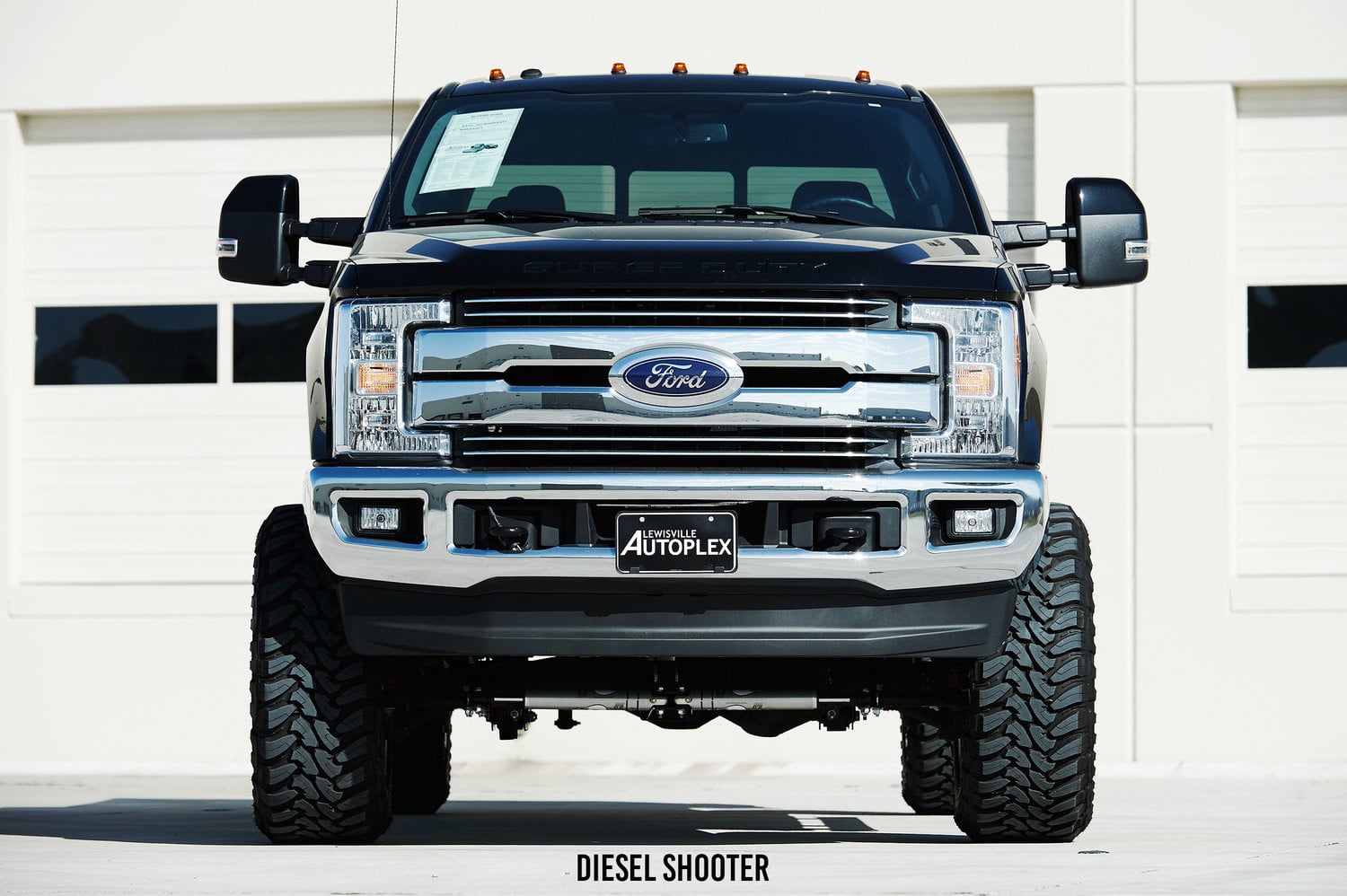 Imposing Black Ford F-350 on Chrome Custom Rims | CARiD.com Gallery