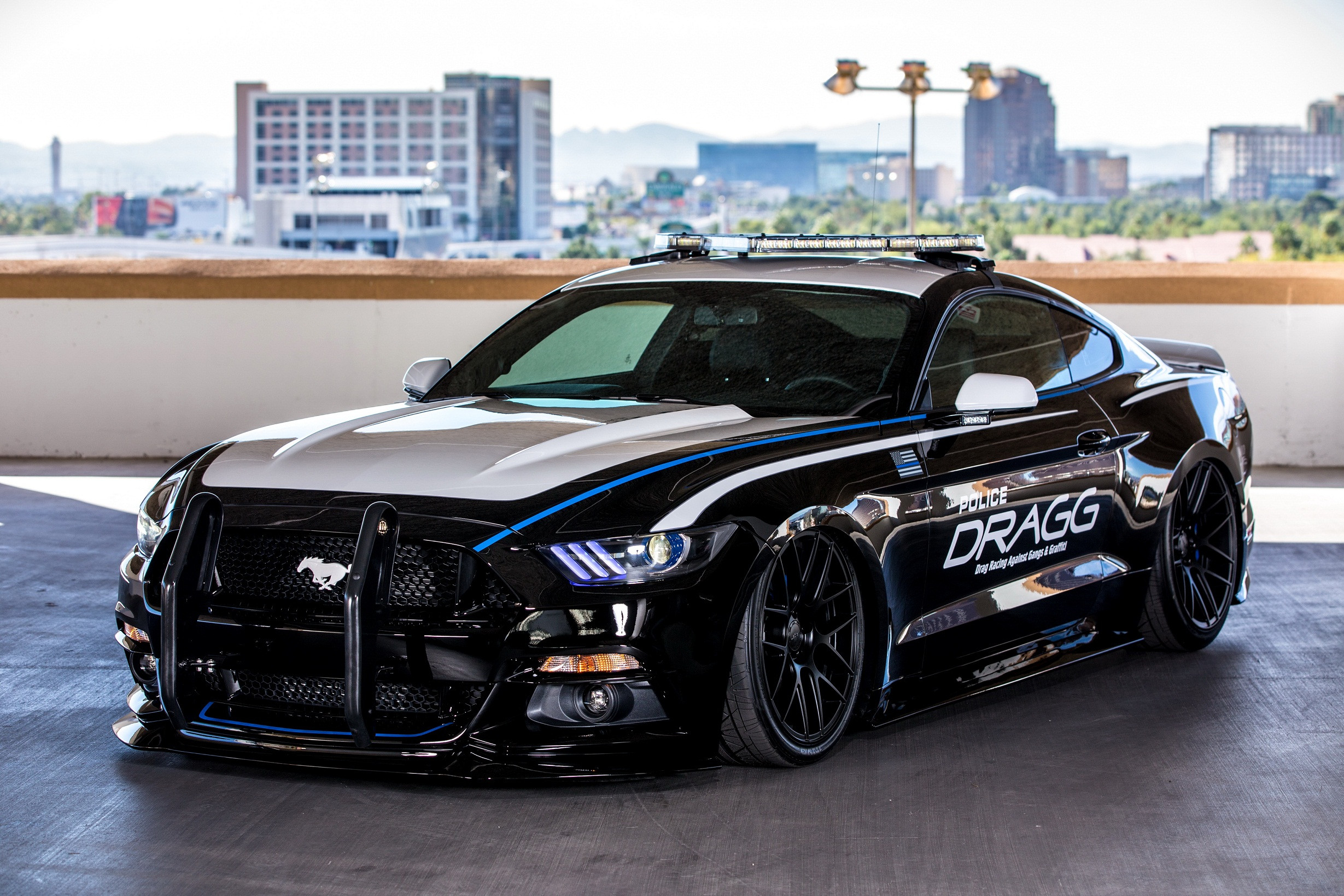 Black Mustang Interceptor With a Push Bar and Air Suspension | CARiD ...