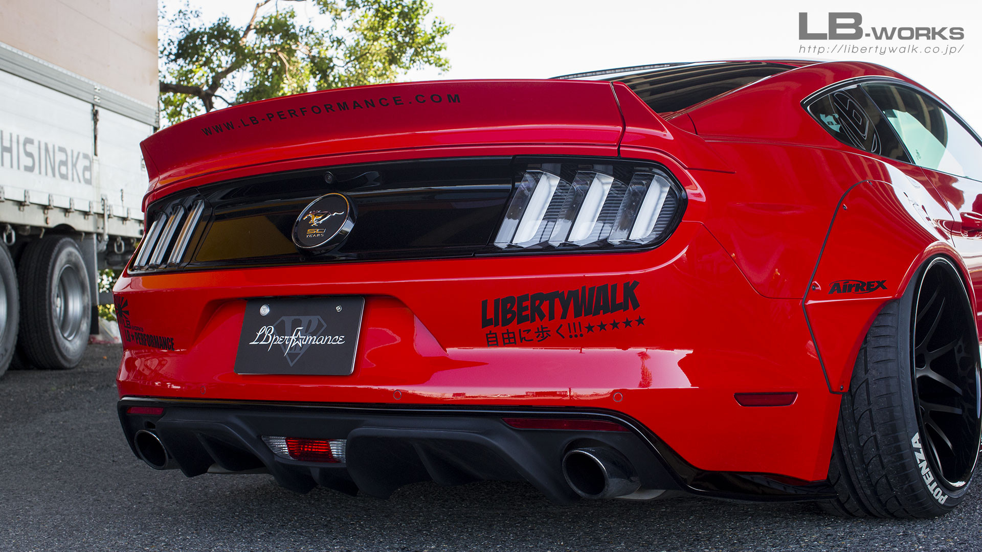Sporty Looking Ford Mustang Lowered on Custom Black Wheels | CARiD.com ...