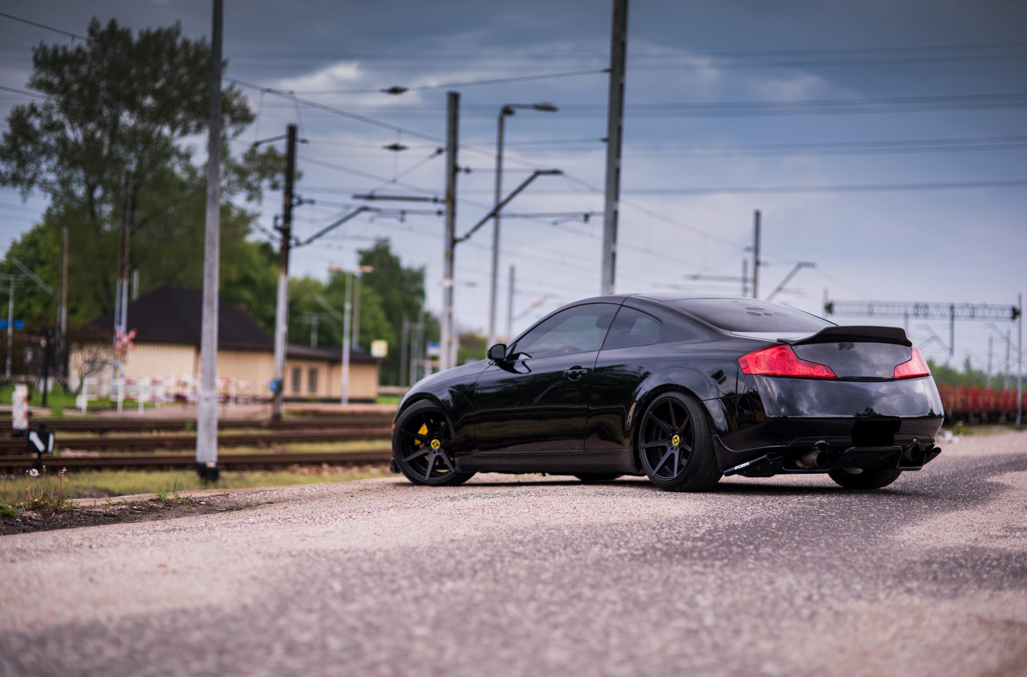 Showy Black Infiniti G35 on JR Rims with Yellow Brakes | CARiD.com Gallery