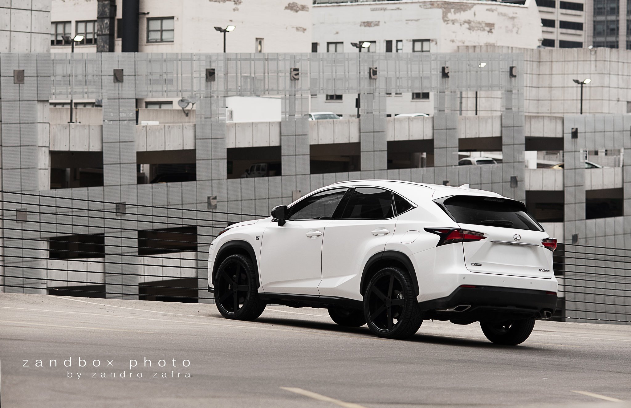 Imposing White Lexus NX Showing Off Matte Black Wheels | CARiD.com Gallery