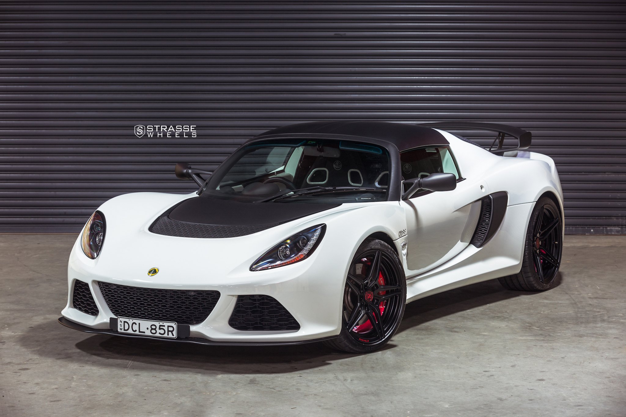 Modified White Lotus Exige Wearing Aftermarket Body Kit and Strasse ...