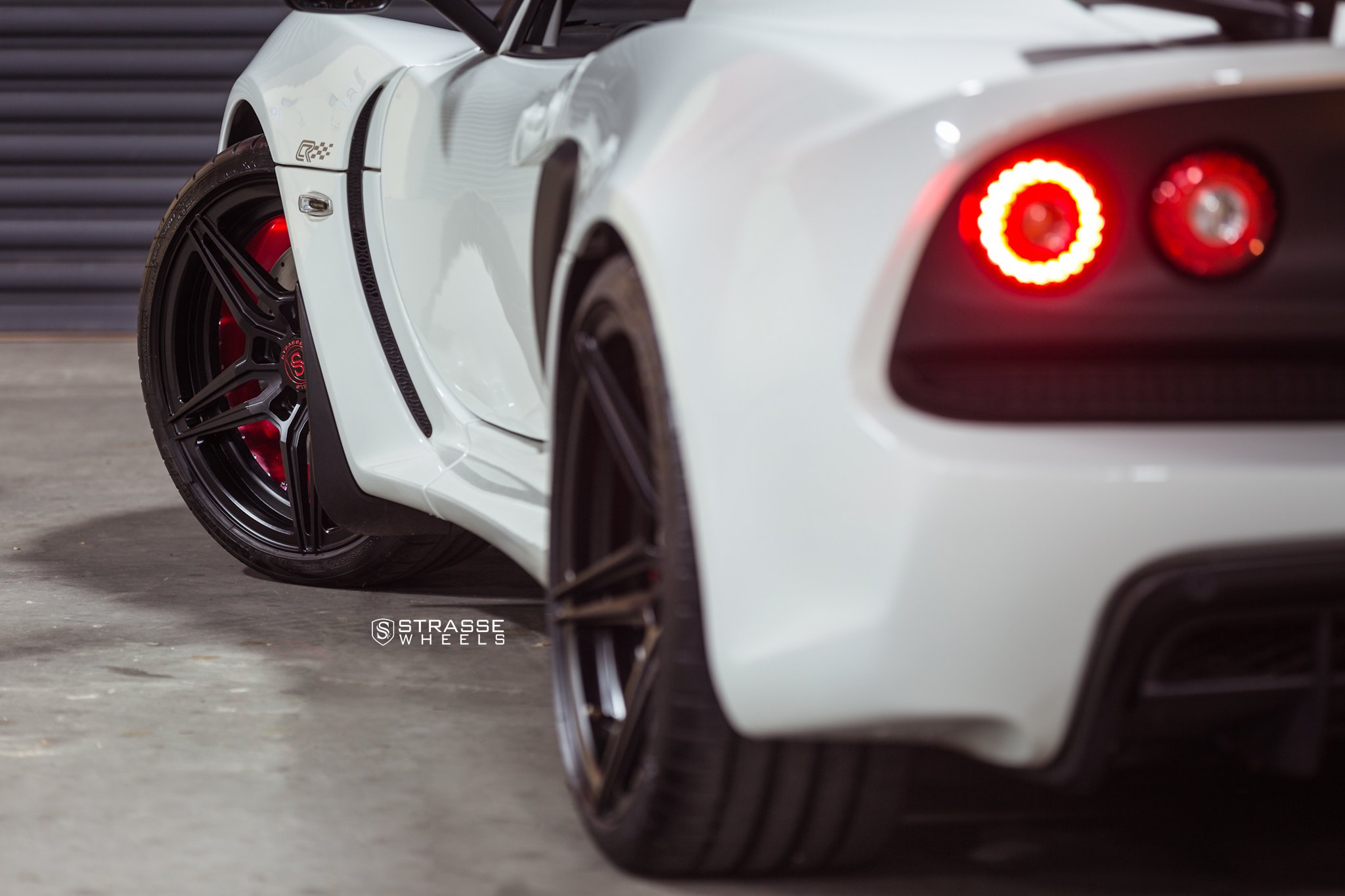 Modified White Lotus Exige Wearing Aftermarket Body Kit and Strasse ...
