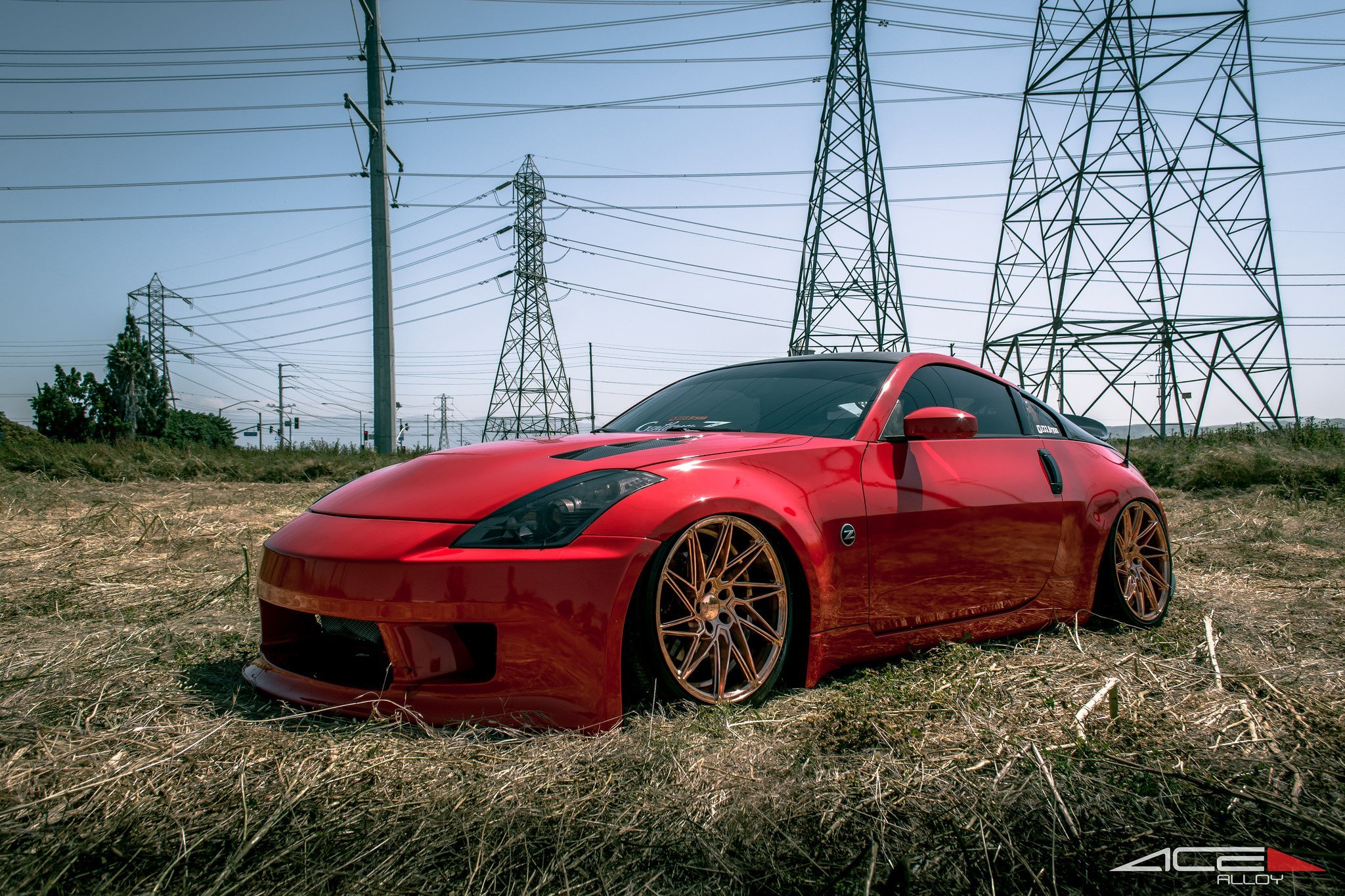 Slammed Nissan 350z with Black headlights and Bronze ACE Wheels | CARiD ...