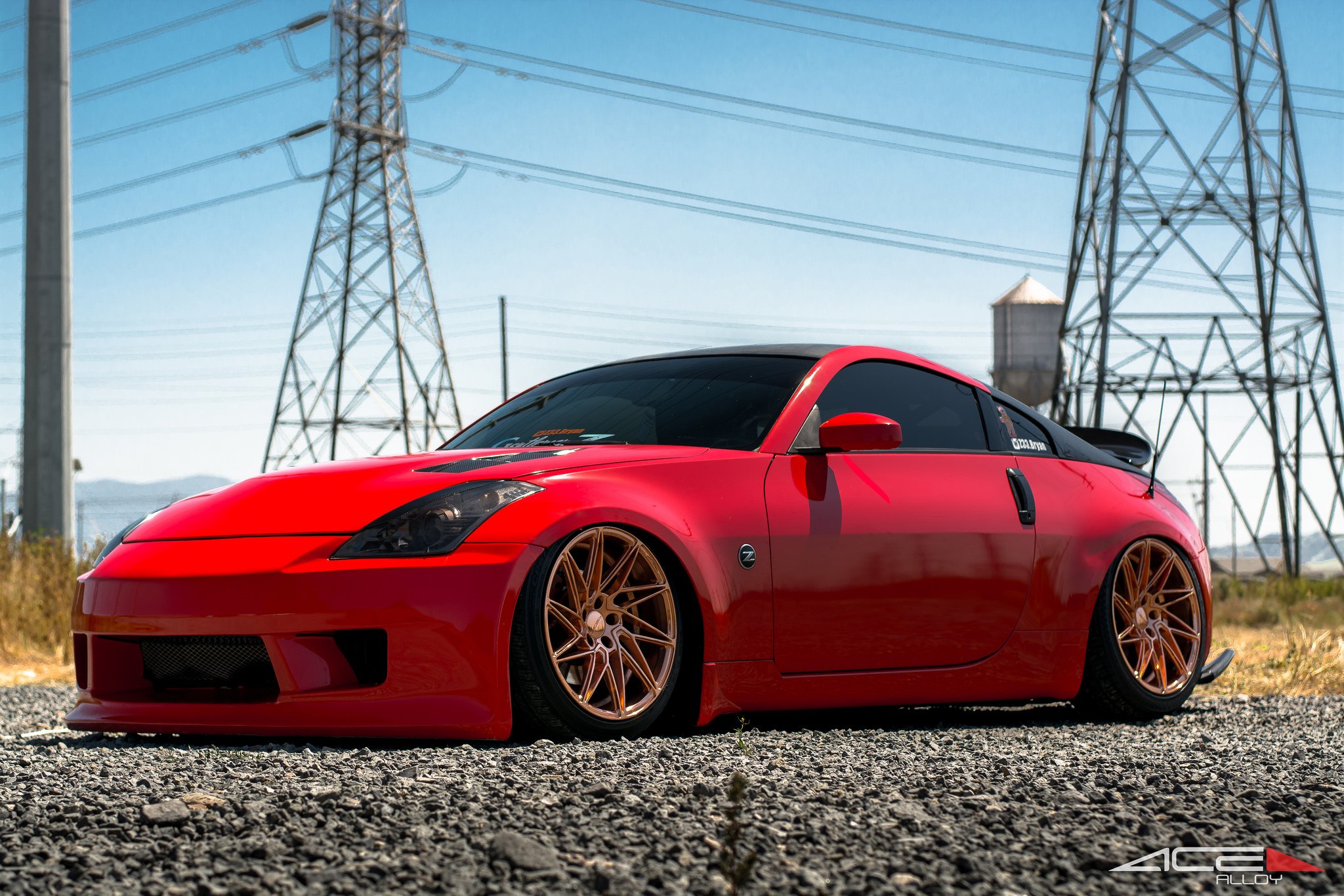 Slammed Nissan 350z with Black headlights and Bronze ACE Wheels | CARiD ...
