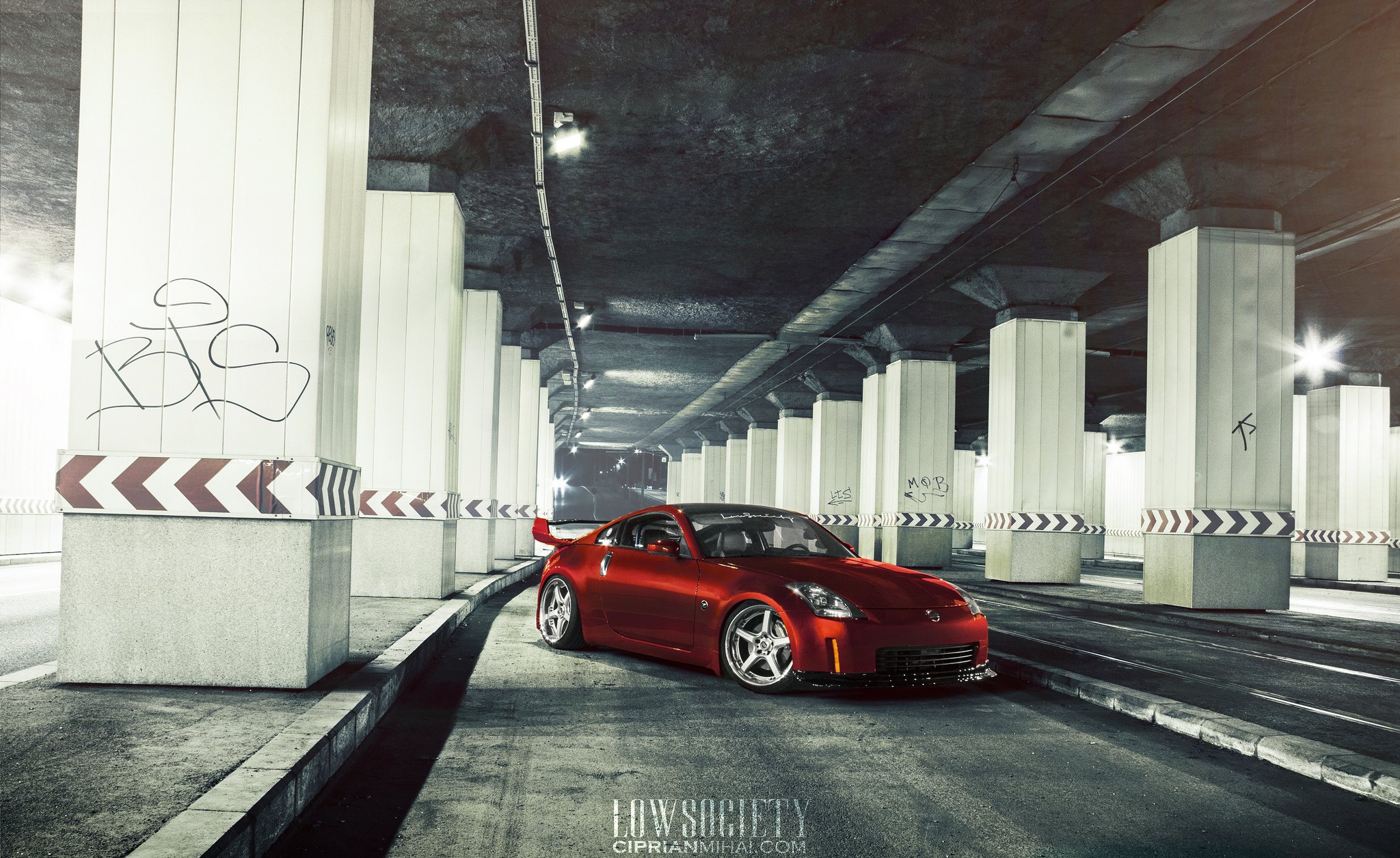 Modified Red Nissan 350Z Driving Low | CARiD.com Gallery