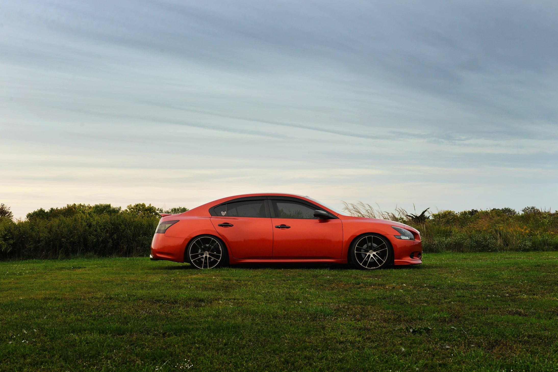 Black Accents on Red Custom Painted Nissan Maxima | CARiD.com Gallery