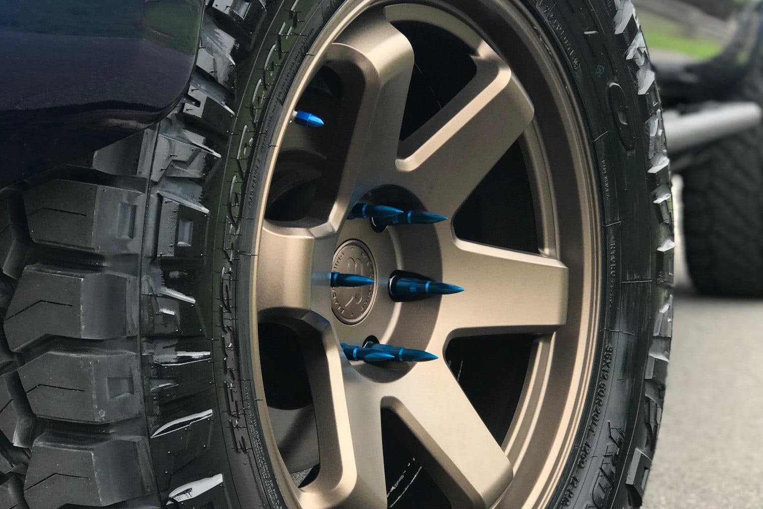 Satin Bronze Black Rhino Wheels Add a Touch of Style to Blue Nissan ...