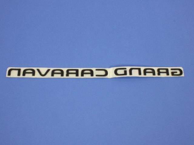 Mopar® 05113304AA - "Grand Caravan" Nameplate Hatch Emblem